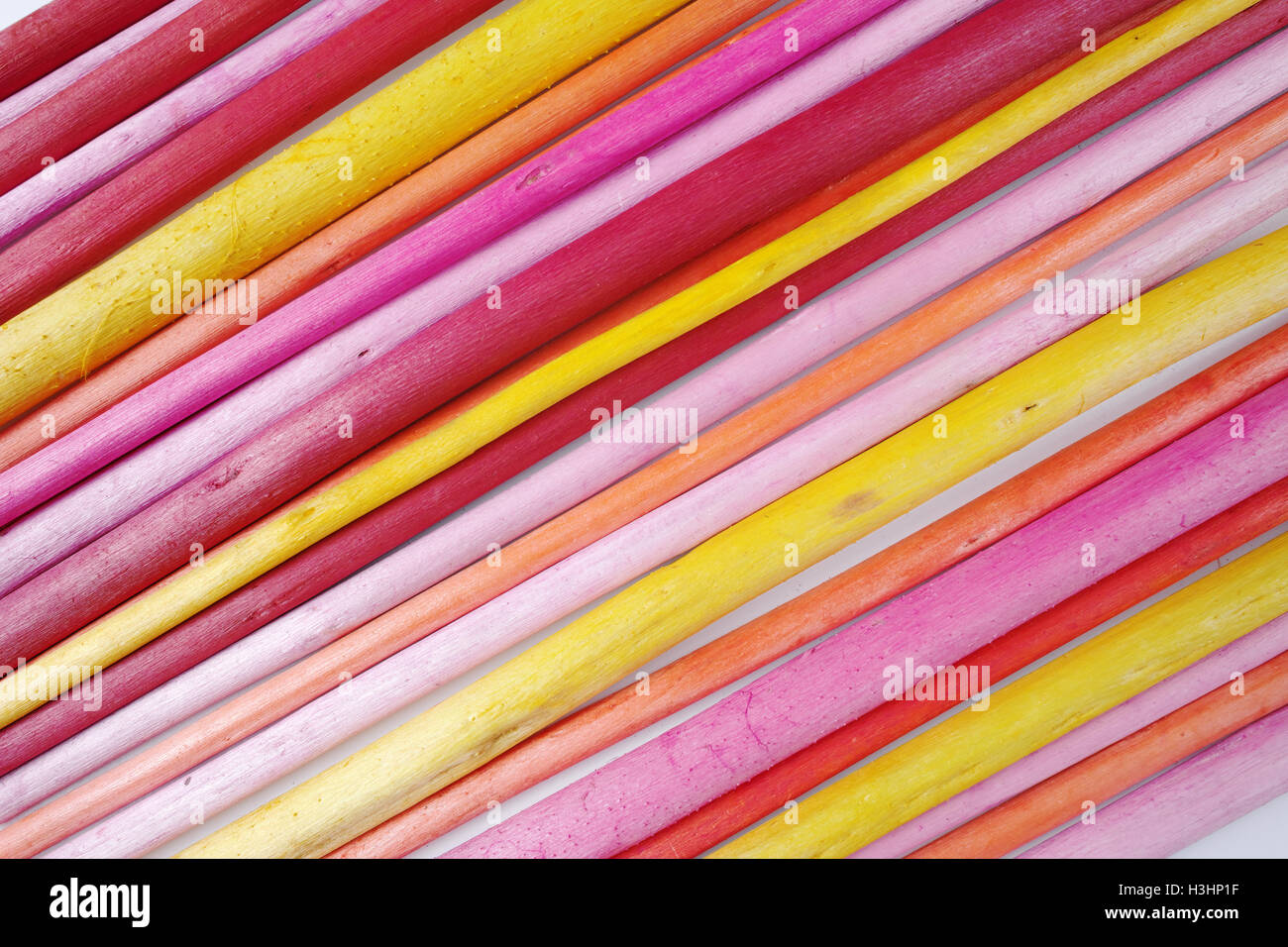 Decorative colorful wooden sticks on white background Stock Photo - Alamy
