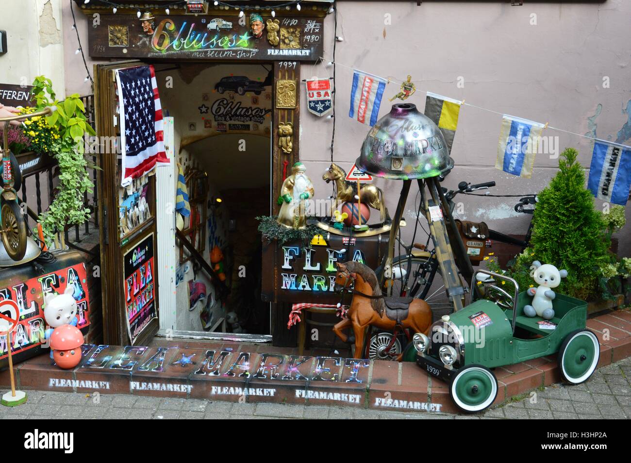 Street café with many things and toys Stock Photo - Alamy