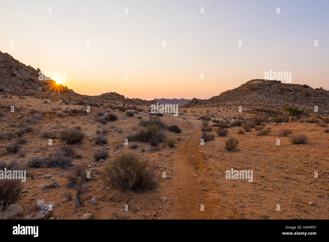 Colorful sunset over the Namib desert, Aus, Namibia, Africa. Sun star ...