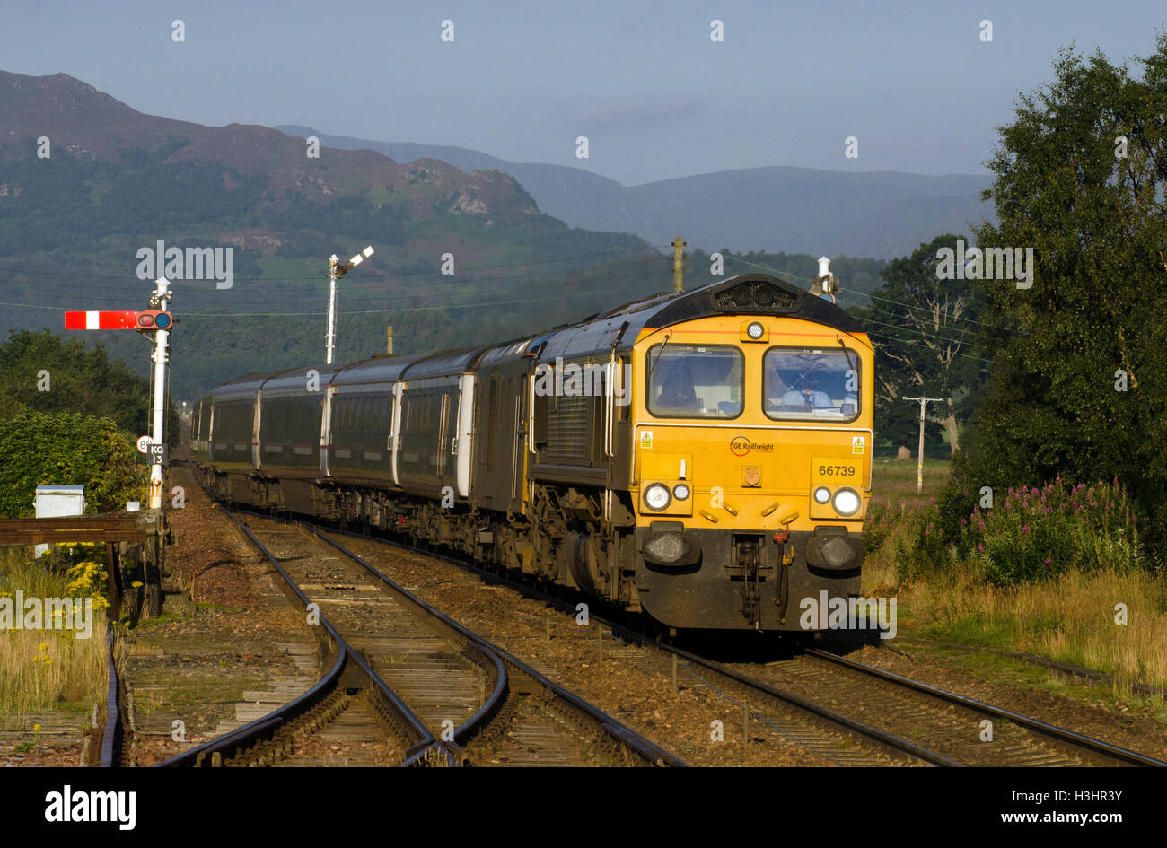 caledonian sleeper approaching kingussie station Stock Photo - Alamy