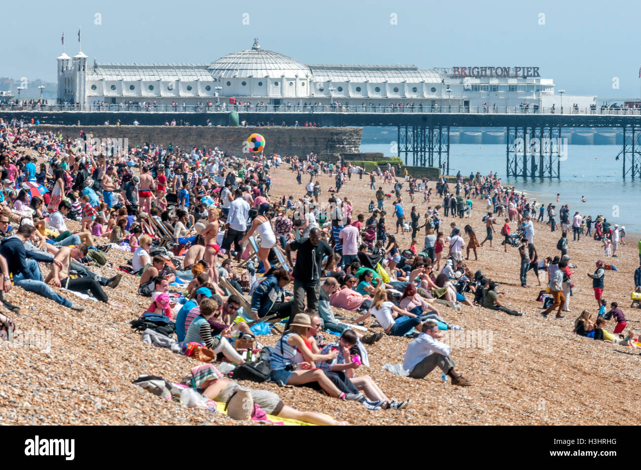 Pebbles on beach with pier hi-res stock photography and images - Alamy