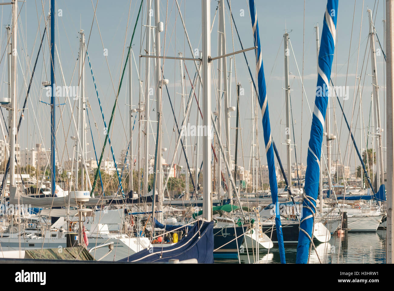 Ship masts on sunrise with blue sky as a background. Larnaca marina ...