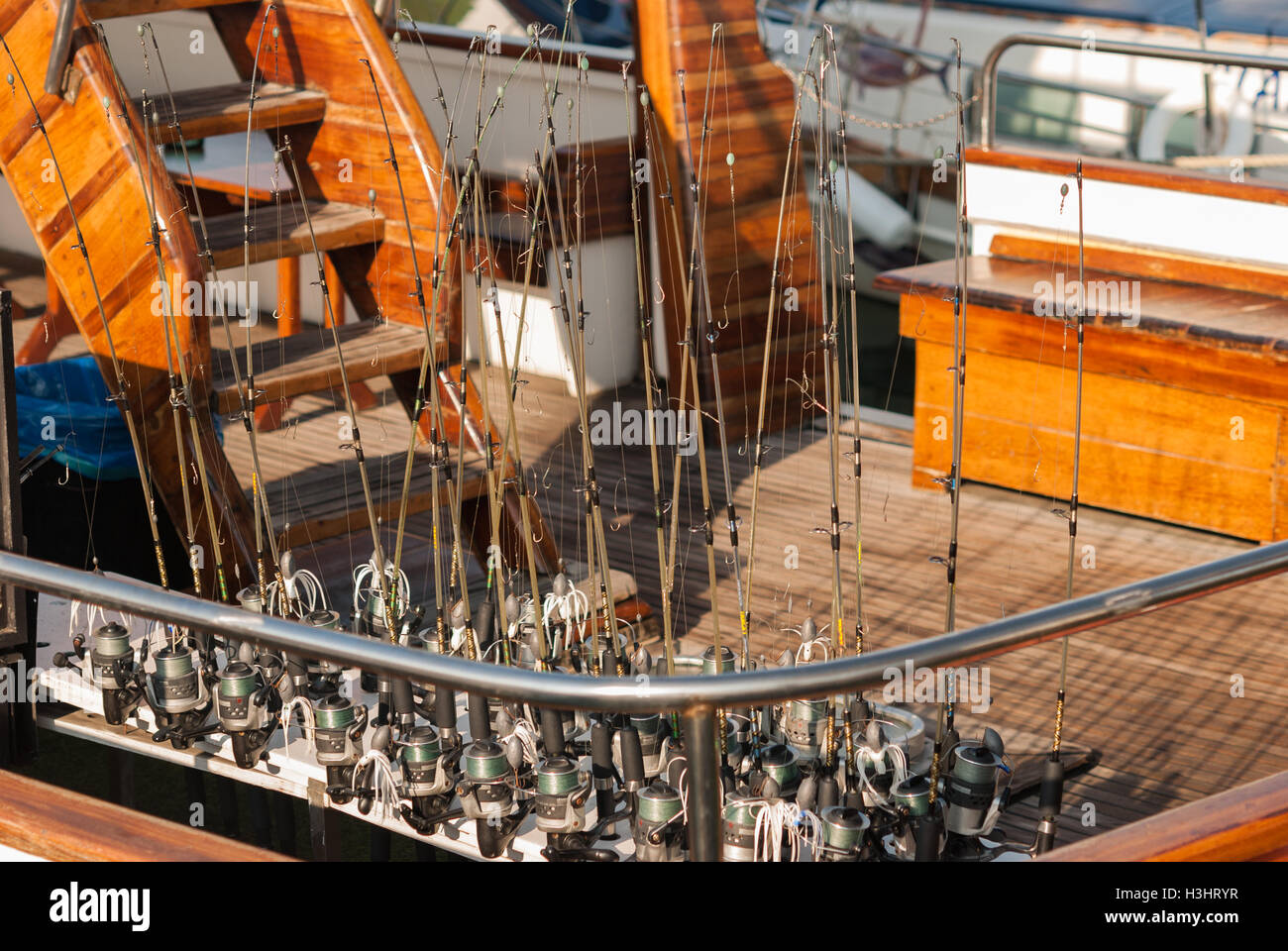 Fishing rods on the commercial fishing boat deck closeup Stock Photo ...