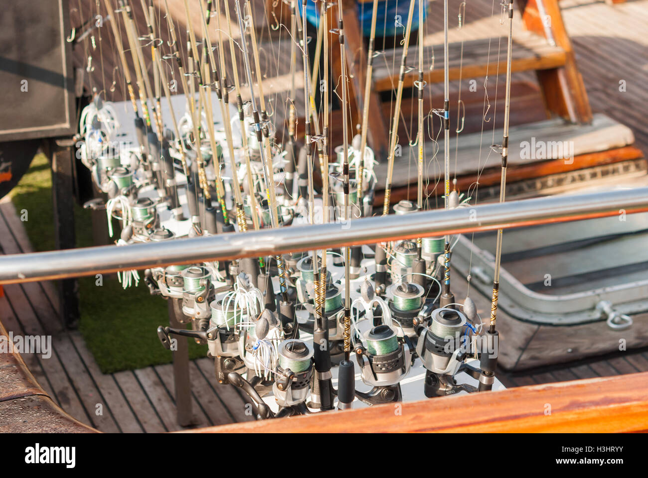 Fishing rods on the commercial fishing boat deck closeup Stock Photo ...