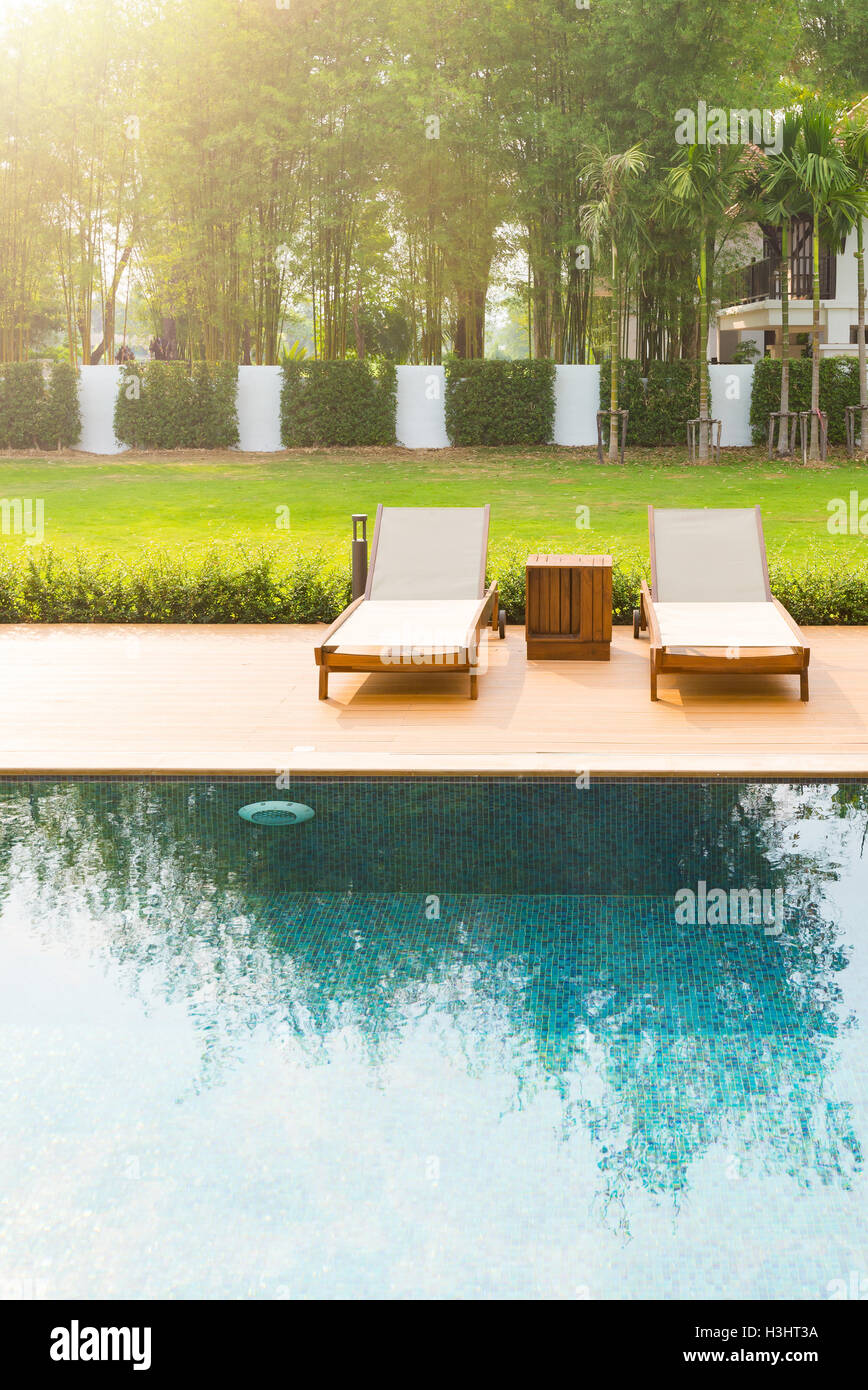 Pool bed beside the tropical resort swimming pool Stock Photo - Alamy