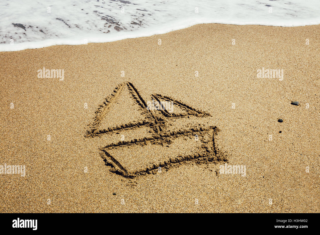 Ship painted on sand beach Stock Photo - Alamy