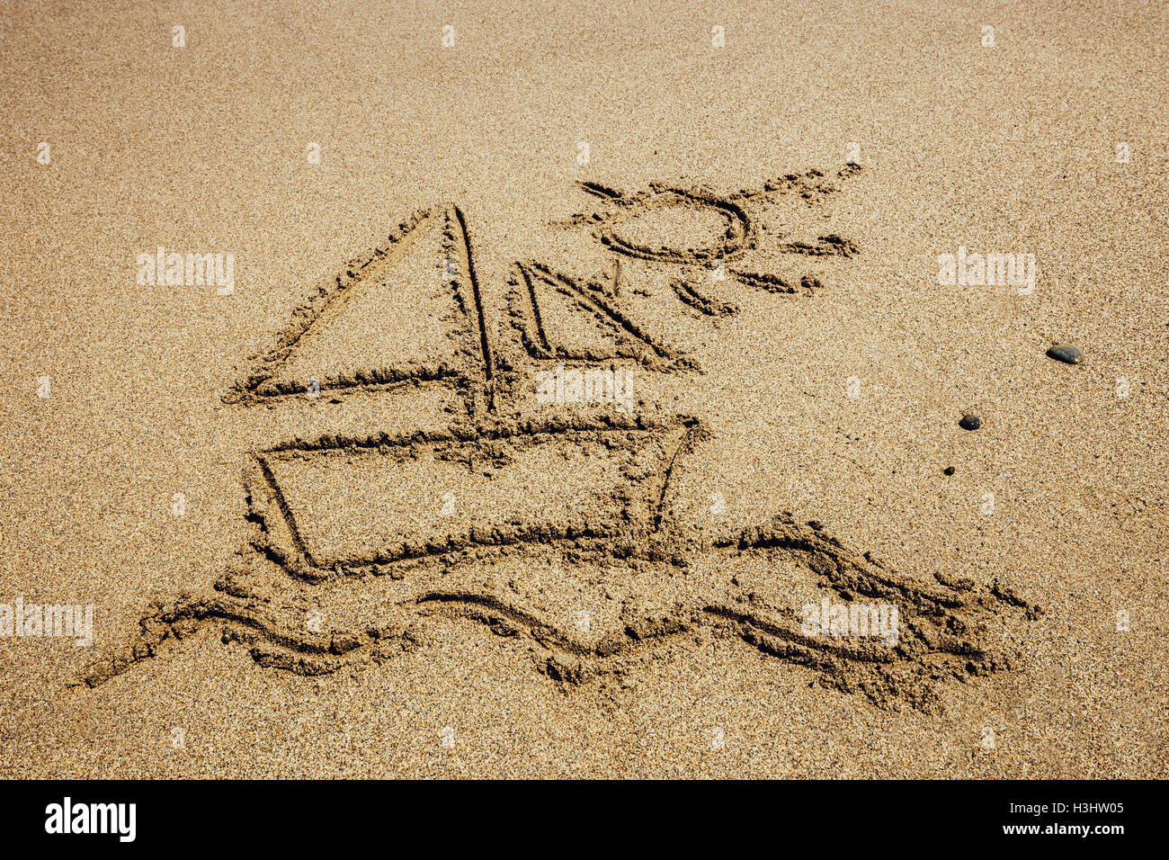 Ship painted on sand beach Stock Photo - Alamy