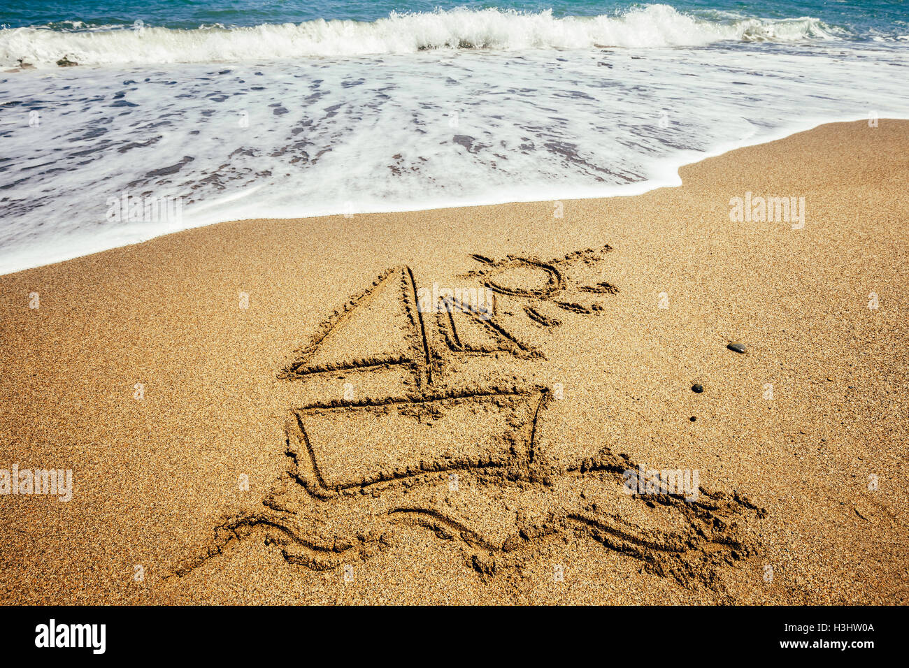 Ship painted on sand beach Stock Photo - Alamy