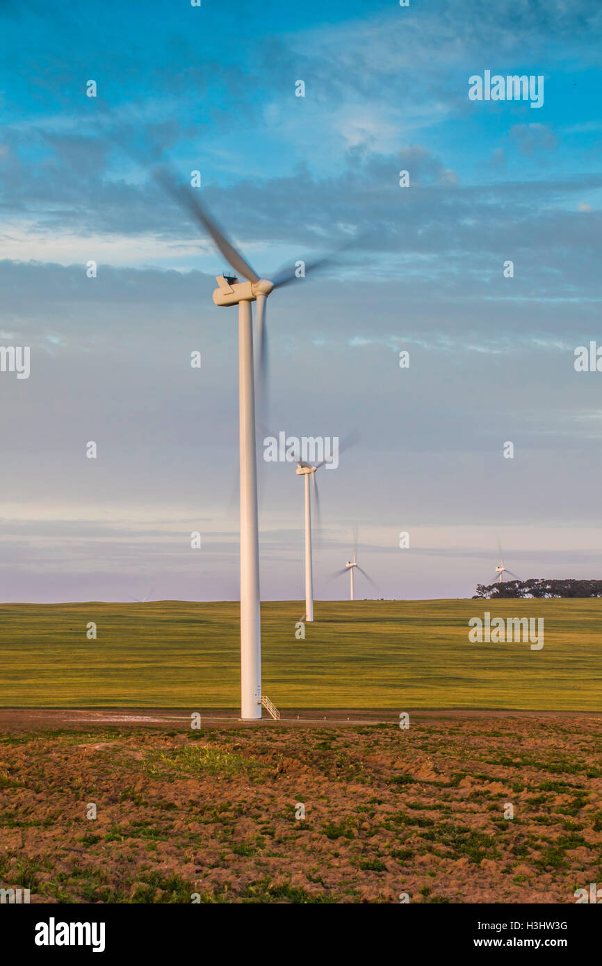 Wind Turbines generating electricity on farm land Stock Photo - Alamy