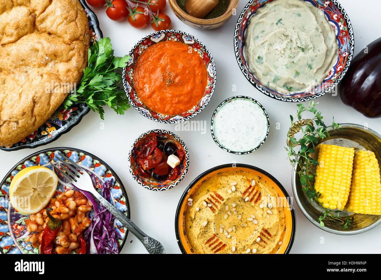 Mediterranean traditional meze: hummus, babaganoush, harissa, tzatziki ...