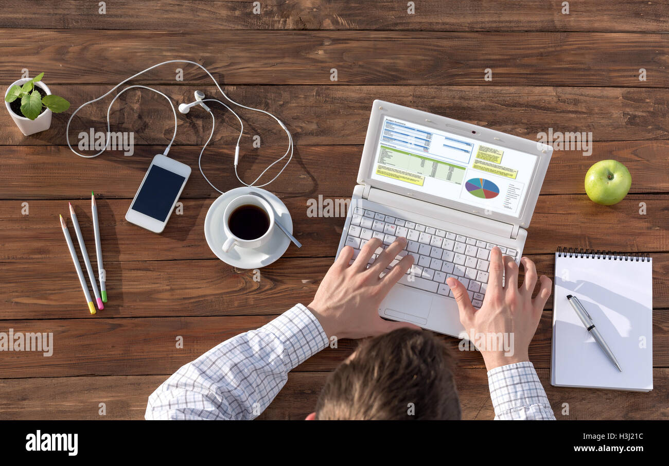 Man working on Computer at wooden Desk overhead View Stock Photo - Alamy
