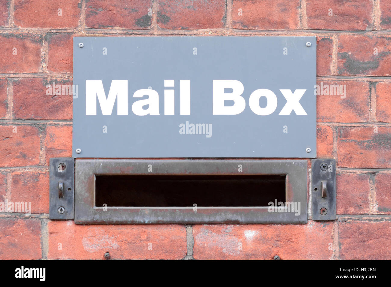 Mail Box sign above large letter box Stock Photo - Alamy