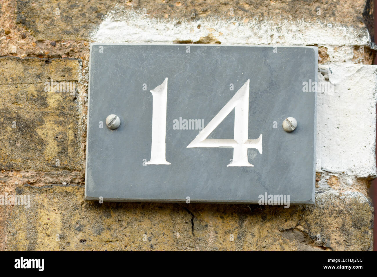 house number 14 sign on wall Stock Photo - Alamy