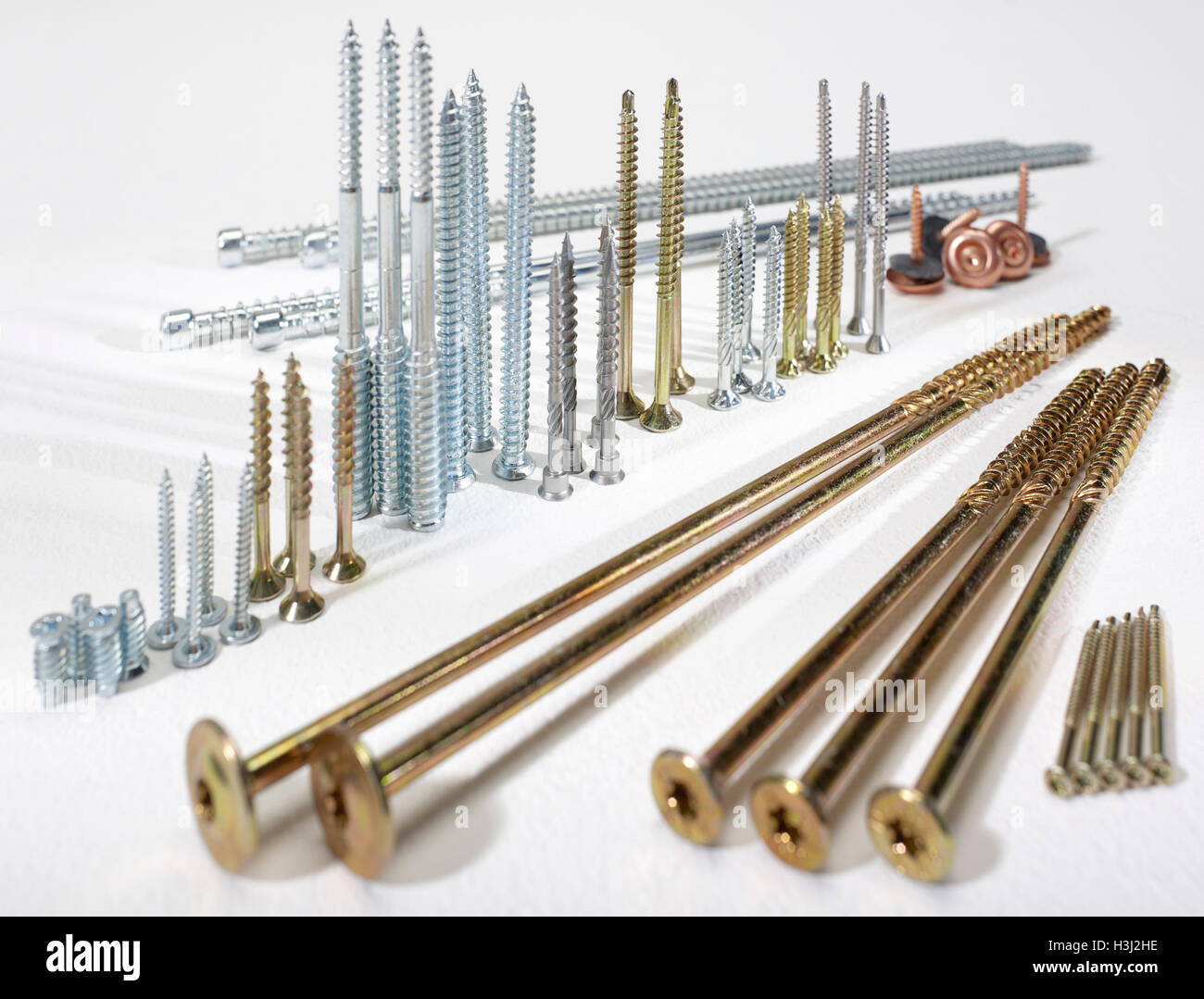 lots of various screws in light back Stock Photo - Alamy
