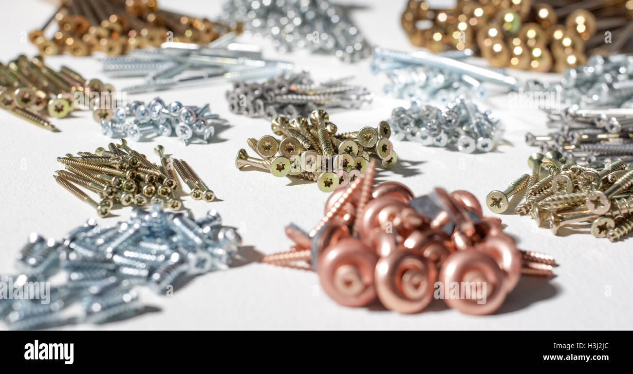 lots of various screws in light back Stock Photo - Alamy
