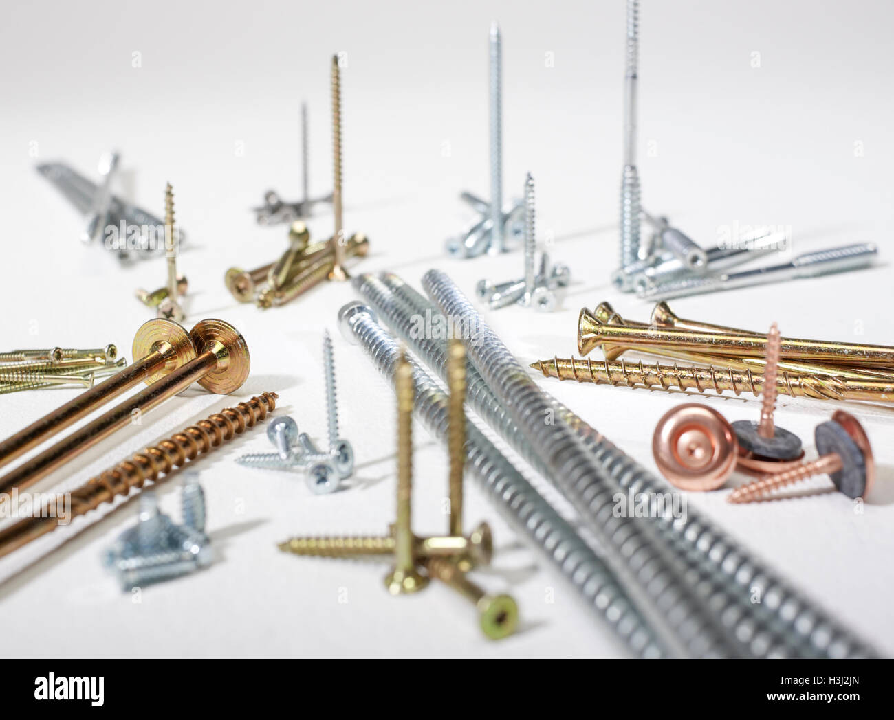 lots of various screws in light back Stock Photo - Alamy