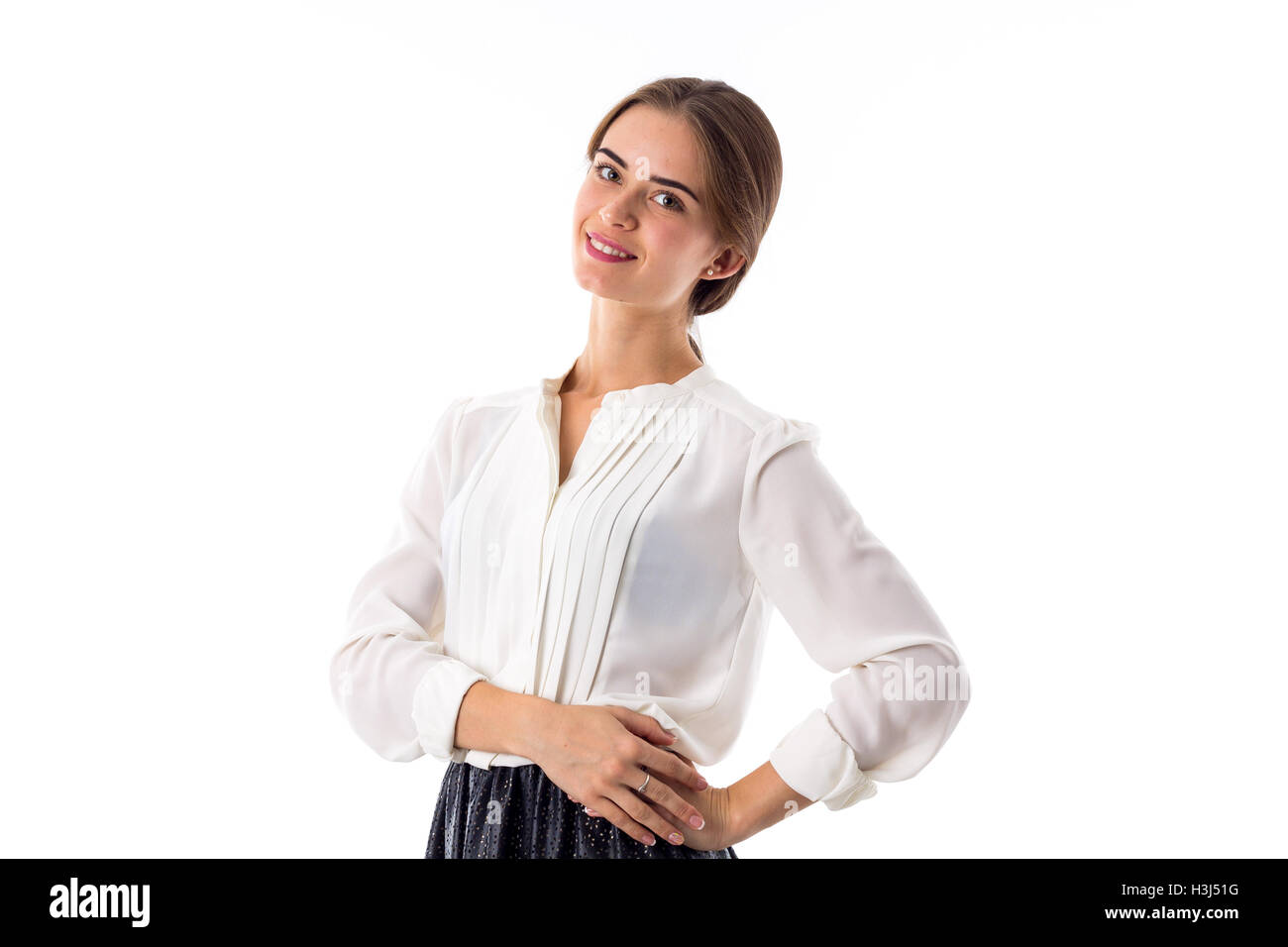 Woman standing and smiling Stock Photo - Alamy