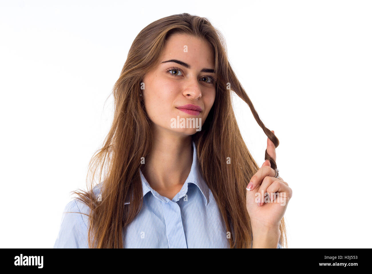 Woman curving her hair Stock Photo - Alamy