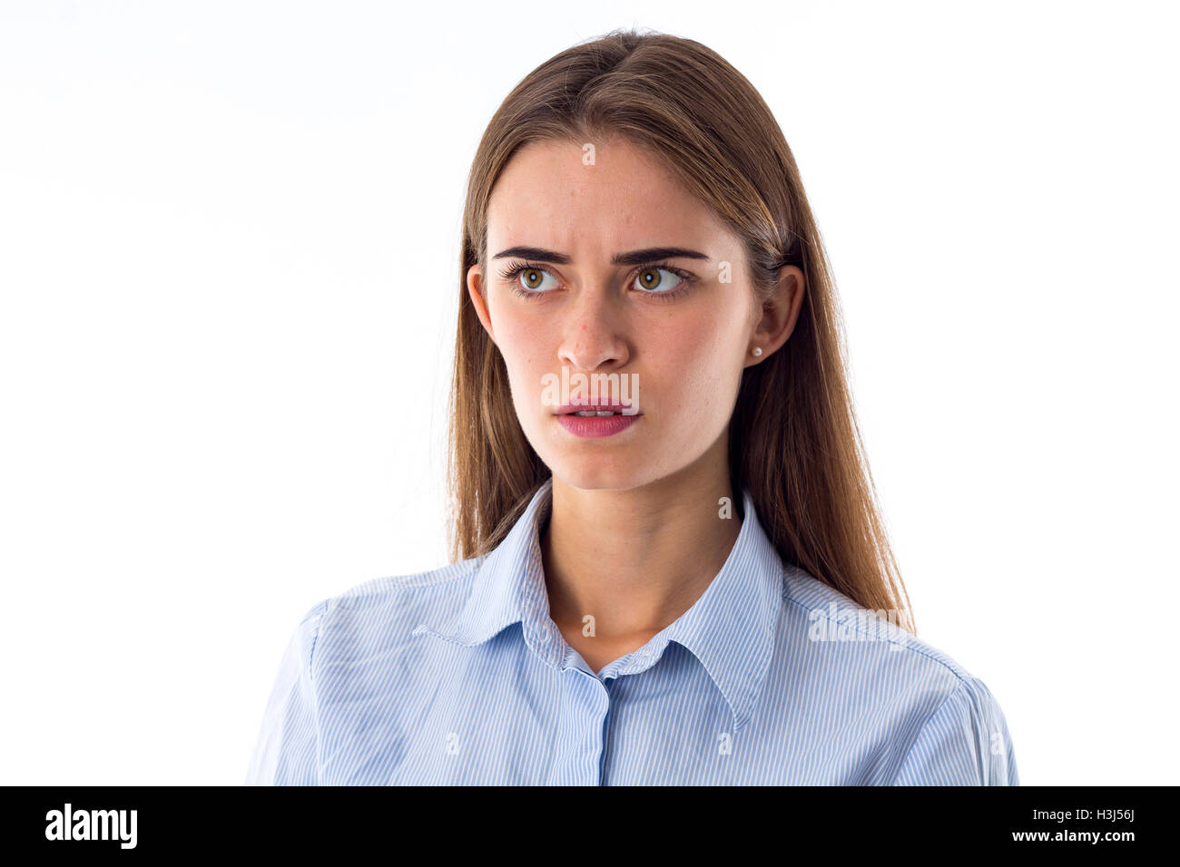 Young woman looking scared Stock Photo - Alamy