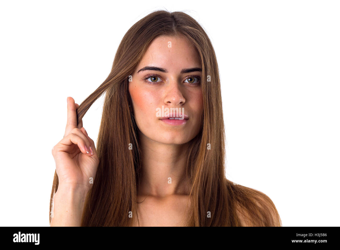 Woman holding a strand of hair Stock Photo - Alamy