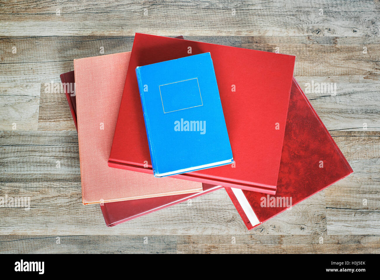 stack of books on the floor Stock Photo - Alamy