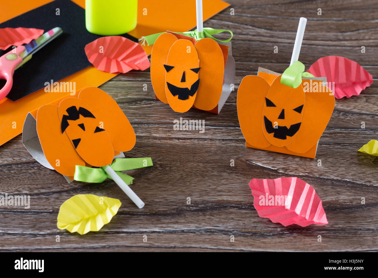 The child create a greeting packaging for candy on Halloween pumpkin ...
