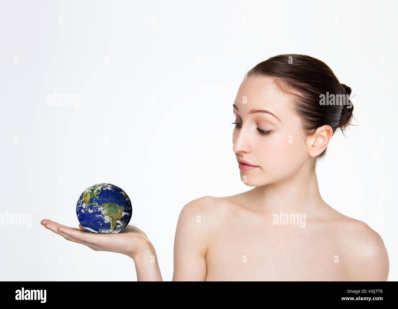 Woman holding planet earth hi-res stock photography and images - Alamy