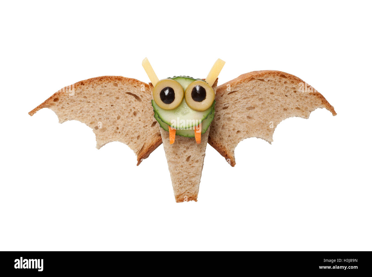 Halloween bat made of bread on white background Stock Photo - Alamy