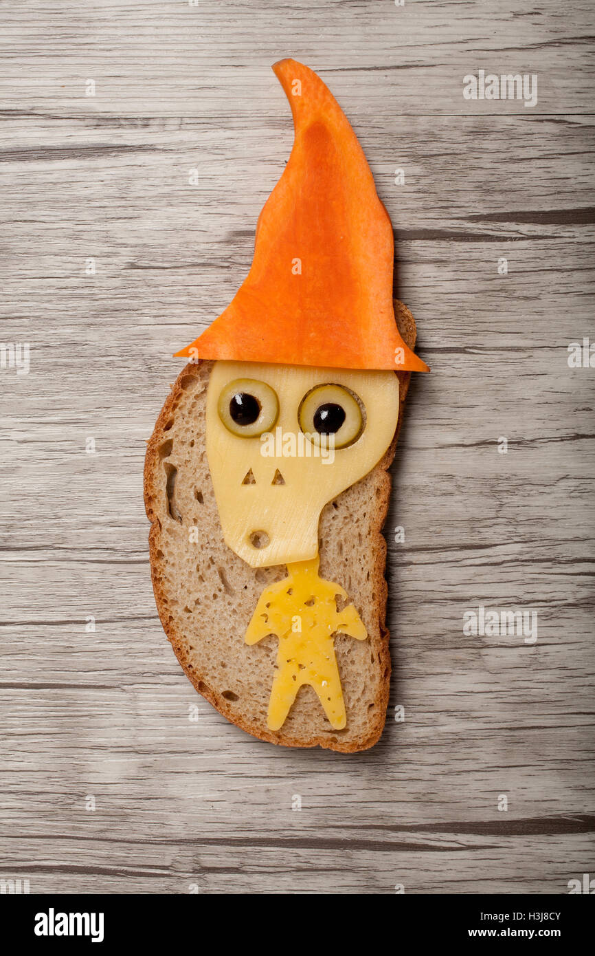 Halloween skull made of bread and cheese on board Stock Photo - Alamy