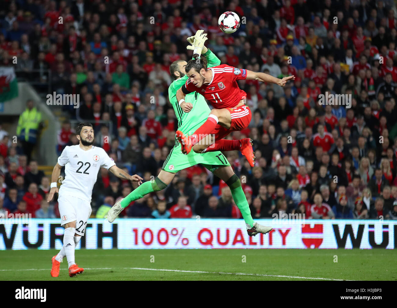 Wales' Gareth Bale (right) and Georgia goalkeeper Giorgi Loria battle ...