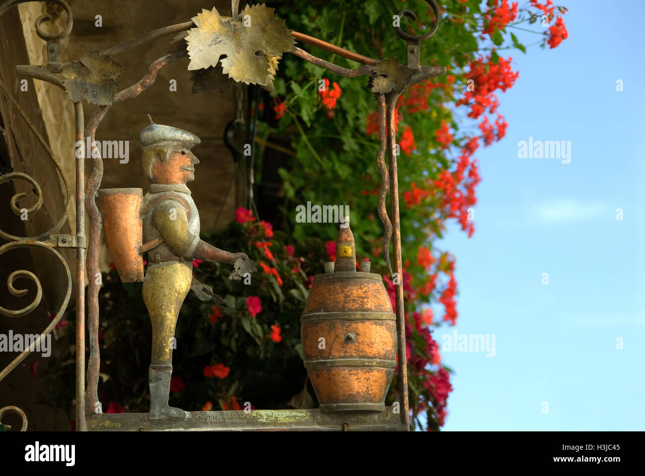 Winery cellar sign of French harvester and barrel inviting tasting ...