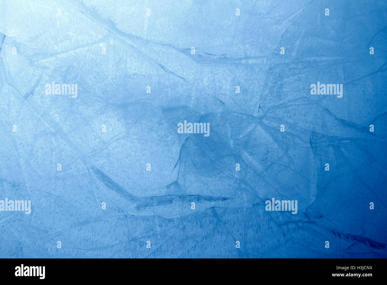 Closeup of cracked blue ice Stock Photo - Alamy