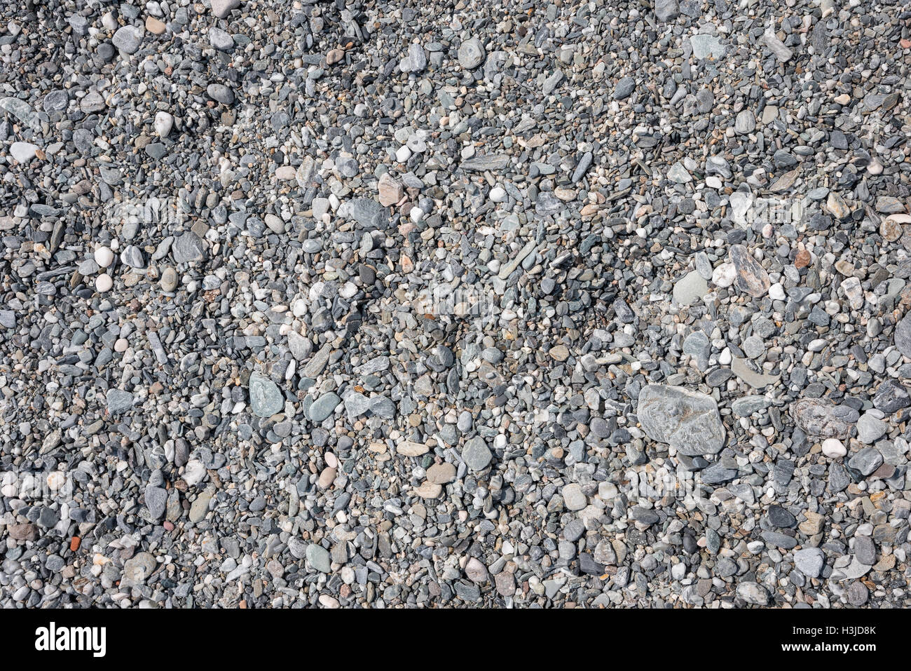 Background ot texture made of gray pebbles Stock Photo - Alamy