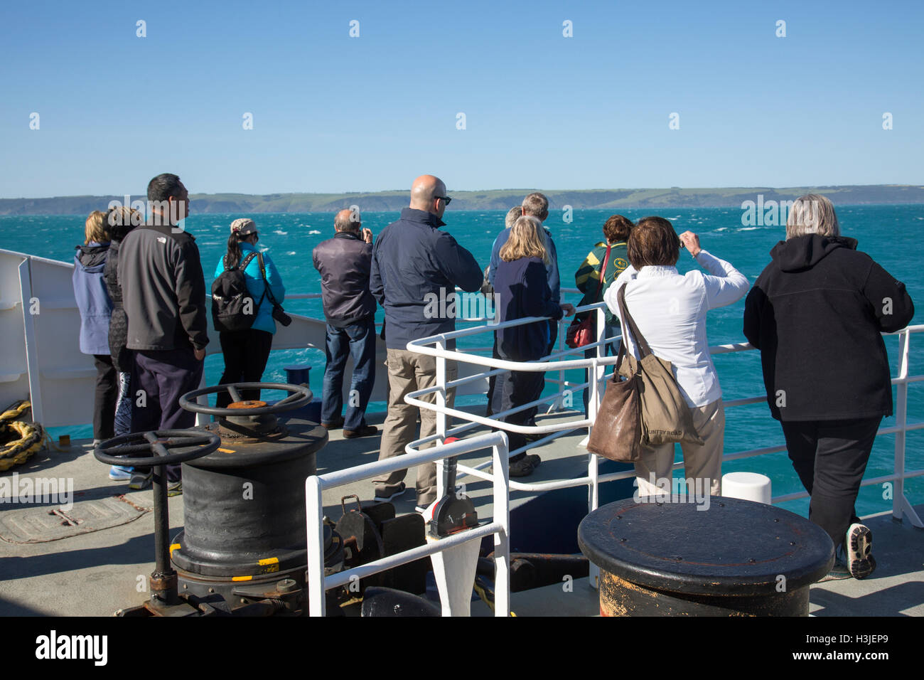 Sealink ferry passengers on front deck observing Kangaroo island as ...