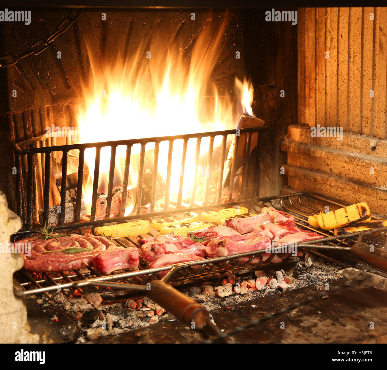 hot fire in the fireplace in the restaurant with lots of pork and beef ...