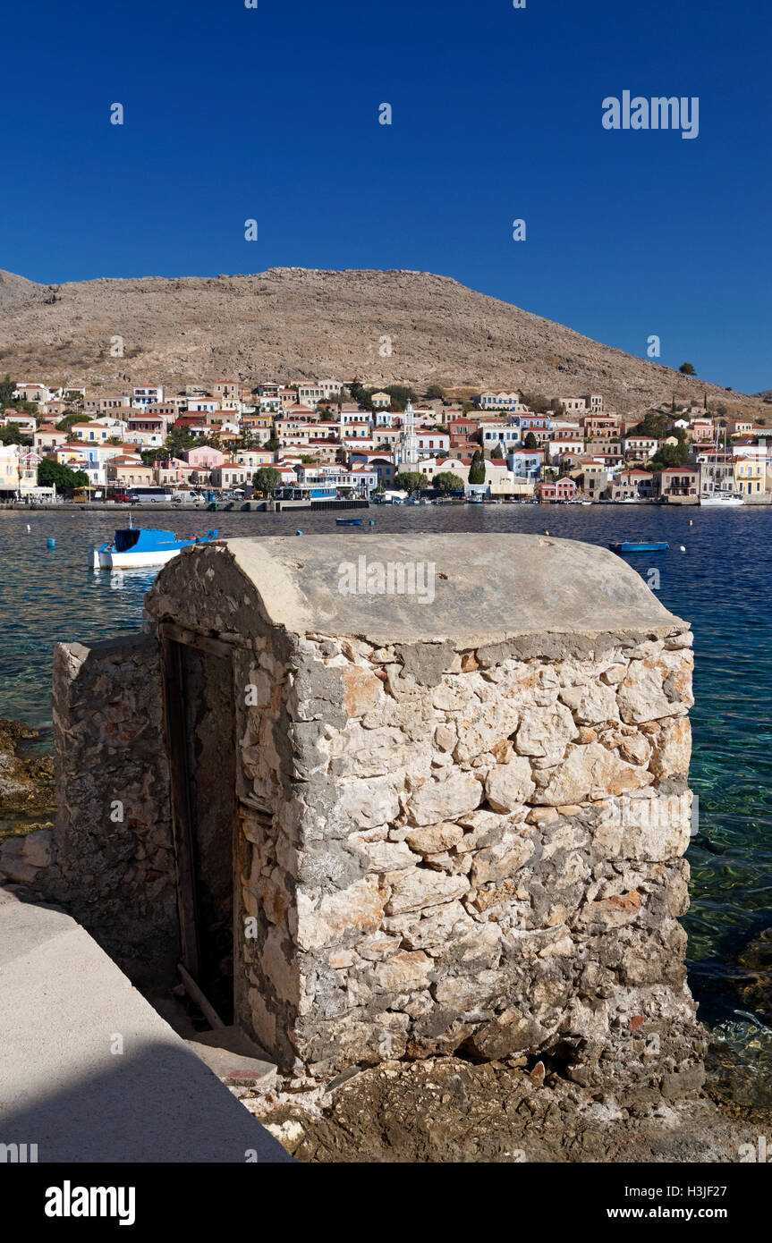Old disused outside toilet, emptying straight into the harbour, Chalki ...