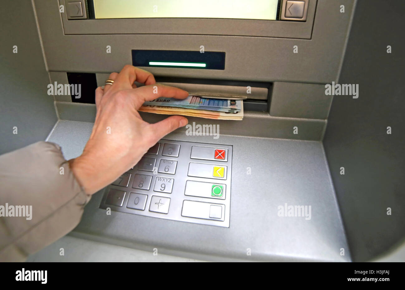 woman while she getting money from ATM Stock Photo - Alamy