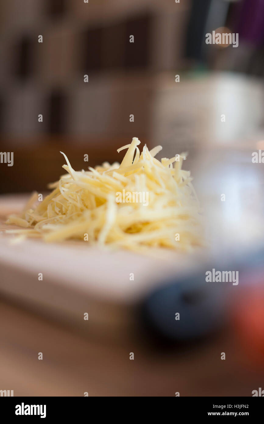 Grated cheese chopping board hi-res stock photography and images - Alamy