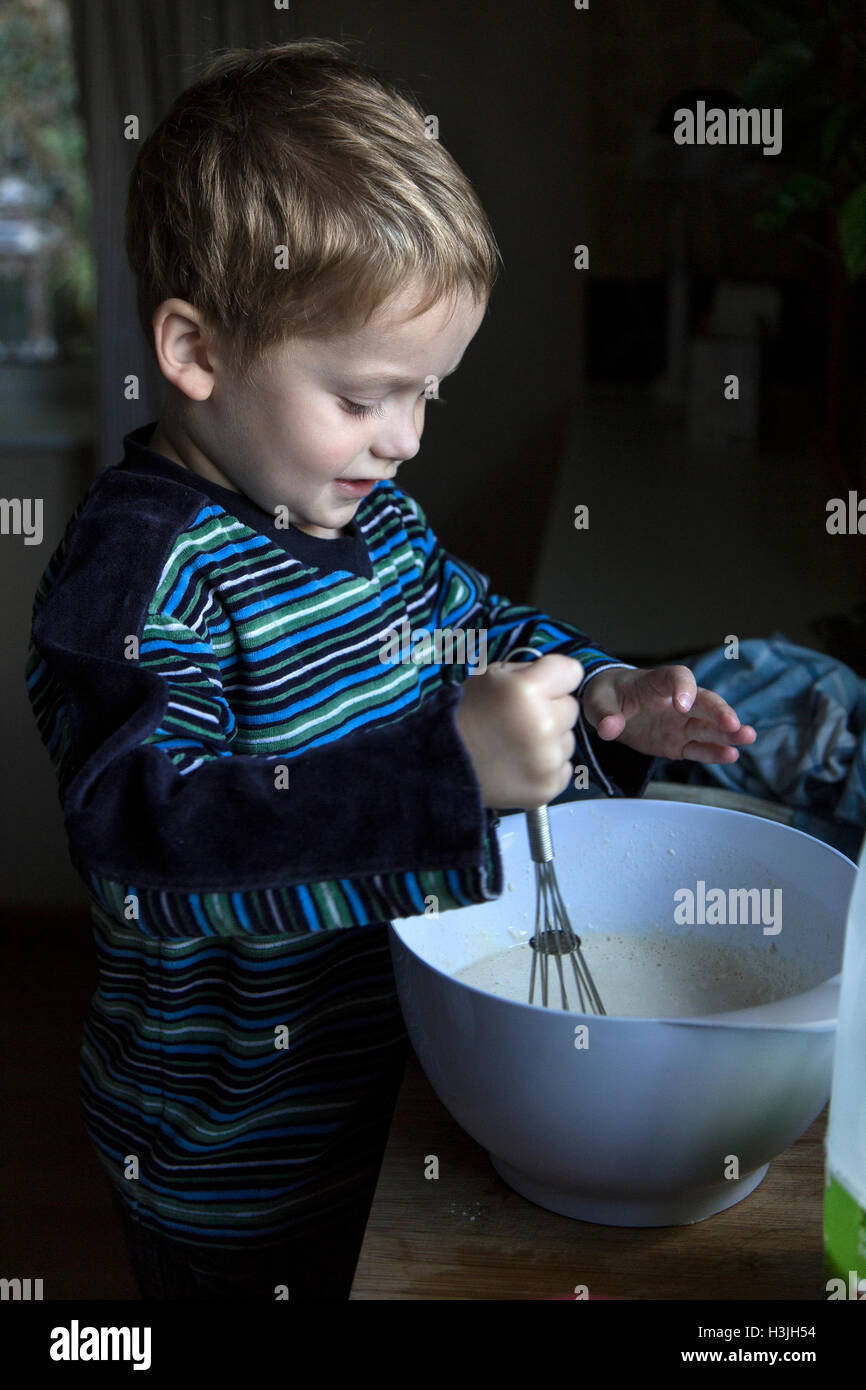 Three year old boy cooking,young boy cooking,young boy helping mum cook ...