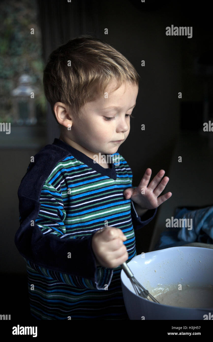 Three year old boy cooking,young boy cooking,young boy helping mum cook ...