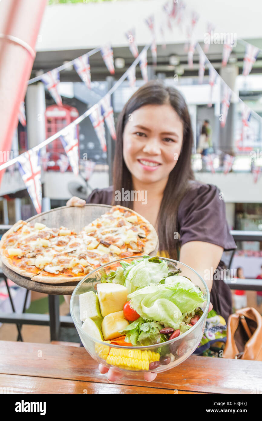Woman holding pizza in restaurant hi-res stock photography and images ...