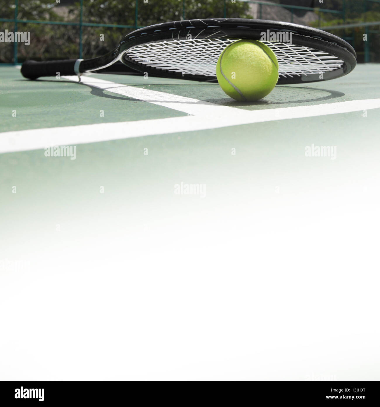 tennis racket and ball on the tennis court Stock Photo - Alamy