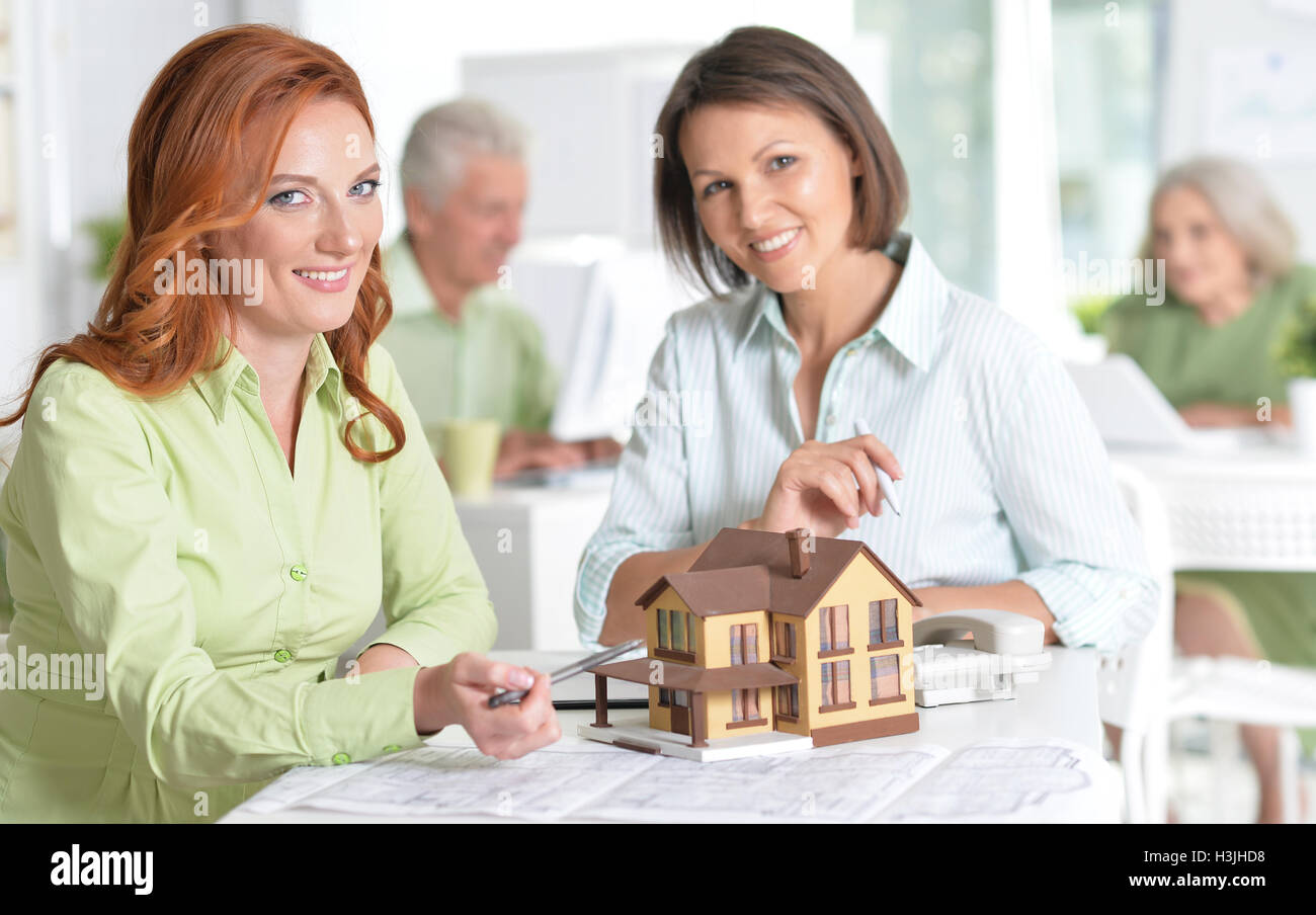 Female house agent and customer Stock Photo - Alamy