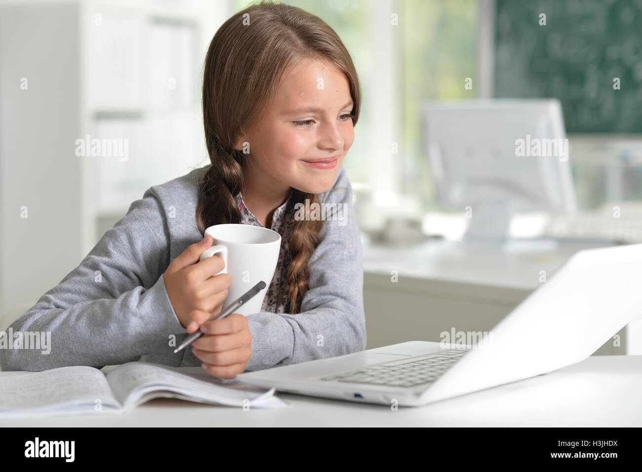 cute girl using laptop computer Stock Photo - Alamy