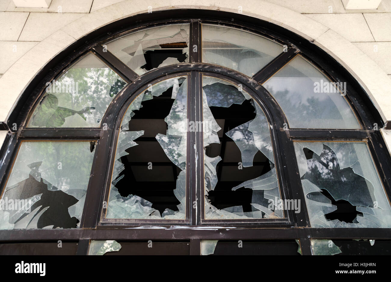 Broken glass in the window of old abandoned hotel, Croatia Stock Photo ...