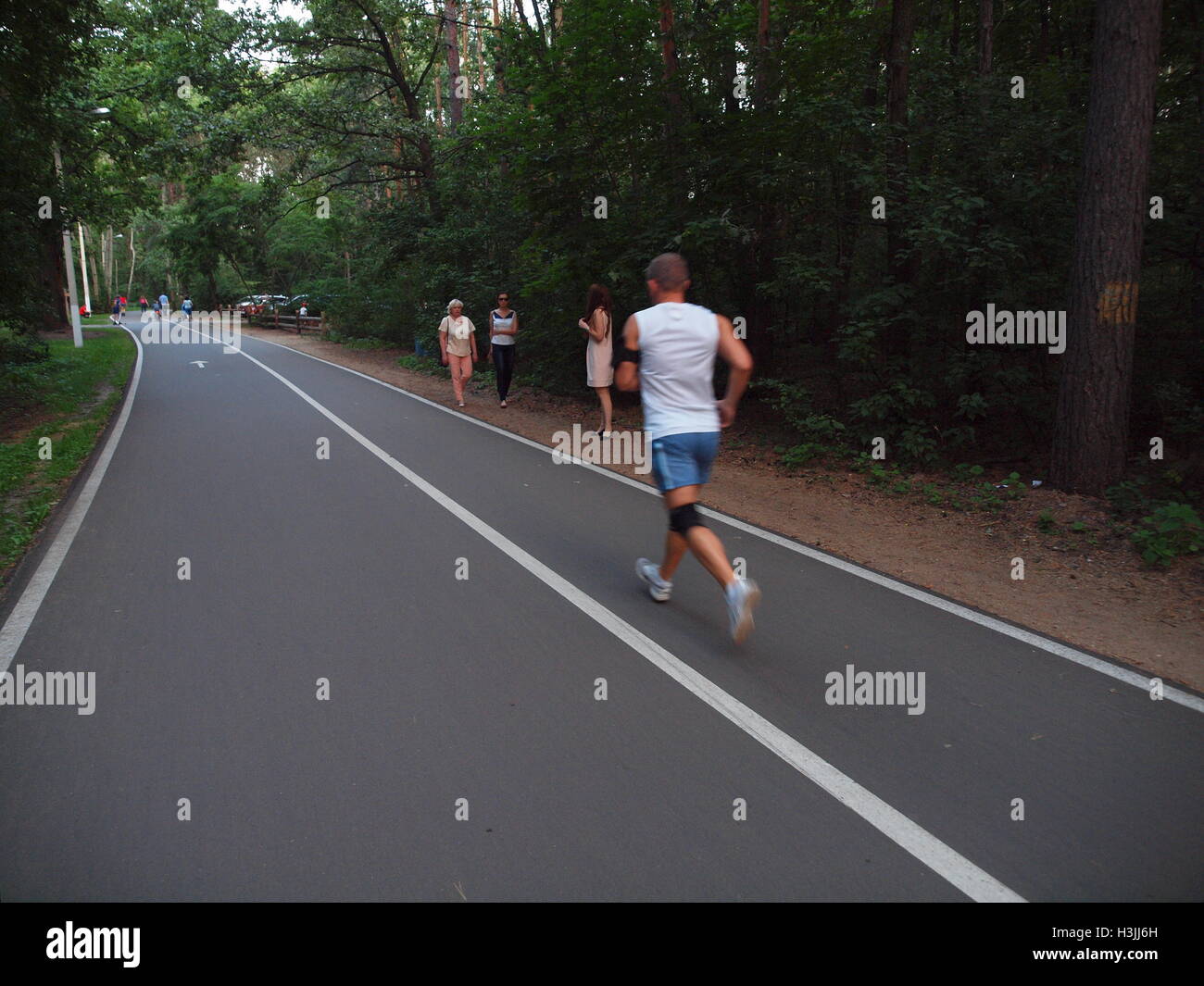Man running in the park Stock Photo - Alamy