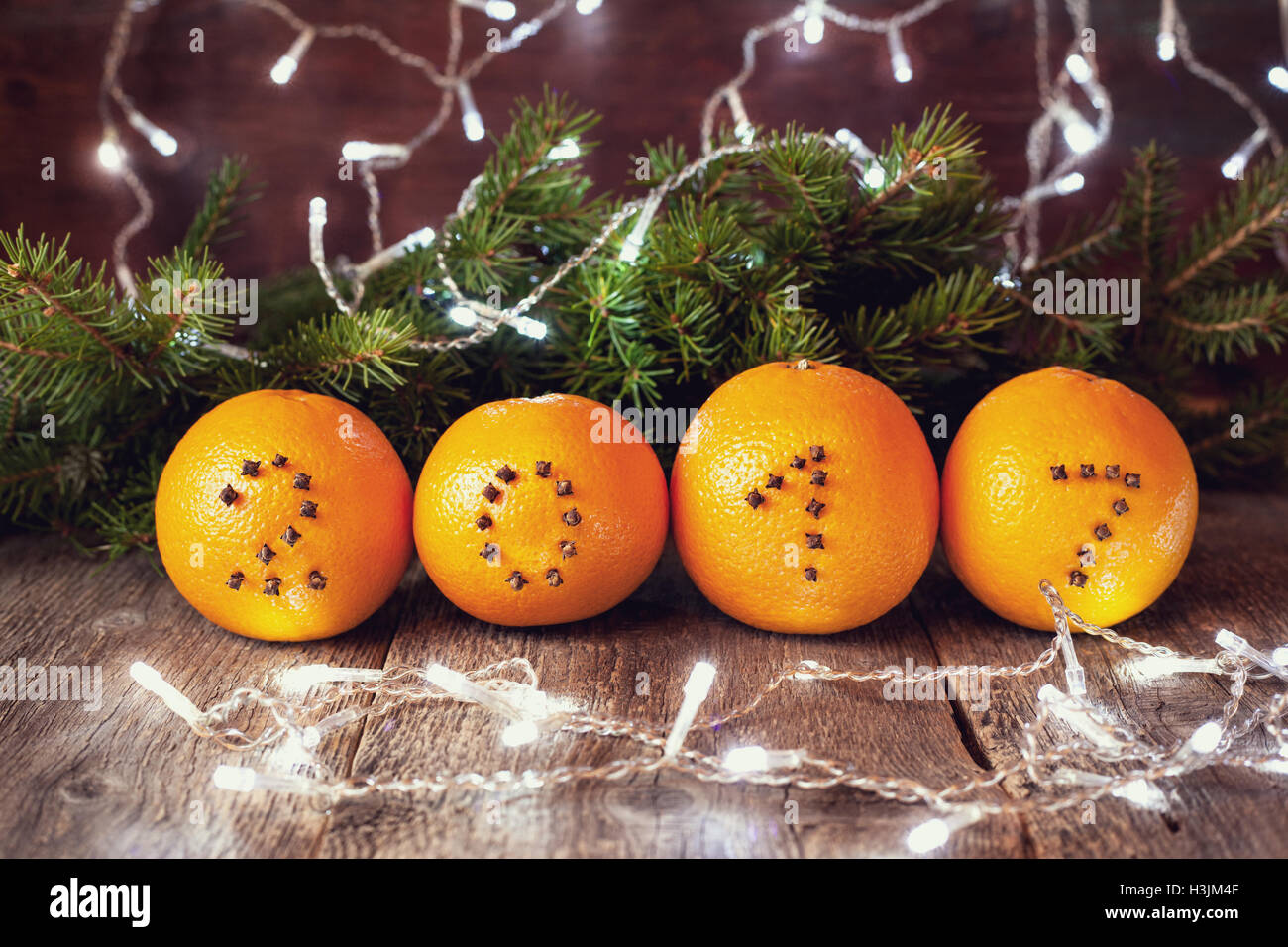 Christmas decorations with oranges and numbers of cloves, garland ...