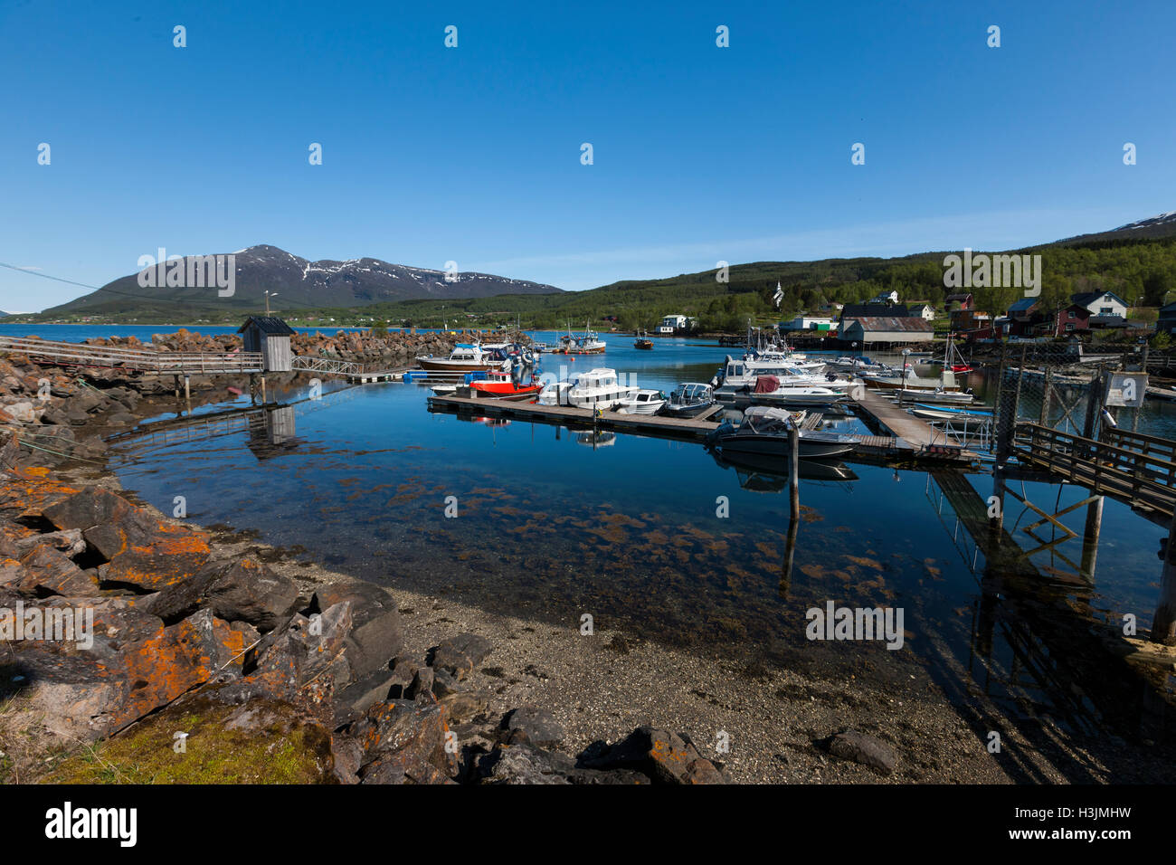 The pretty harbour at Tovik, Norway. A small fishing boat harbour close ...