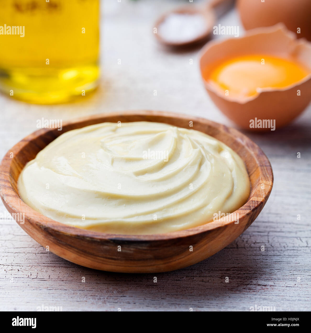 Homemade mayonnaise, mayo in a wooden bowl. White background Stock ...