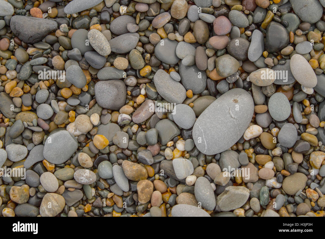Pebbles and sand Background abstract texture stones Stock Photo - Alamy